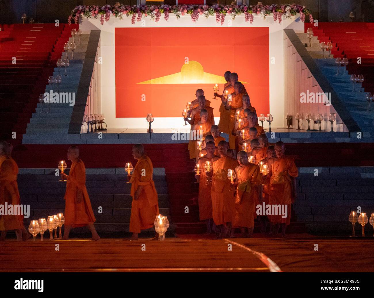 Monks walk around the temple during Makha Bucha Day ceremonies at Wat ...