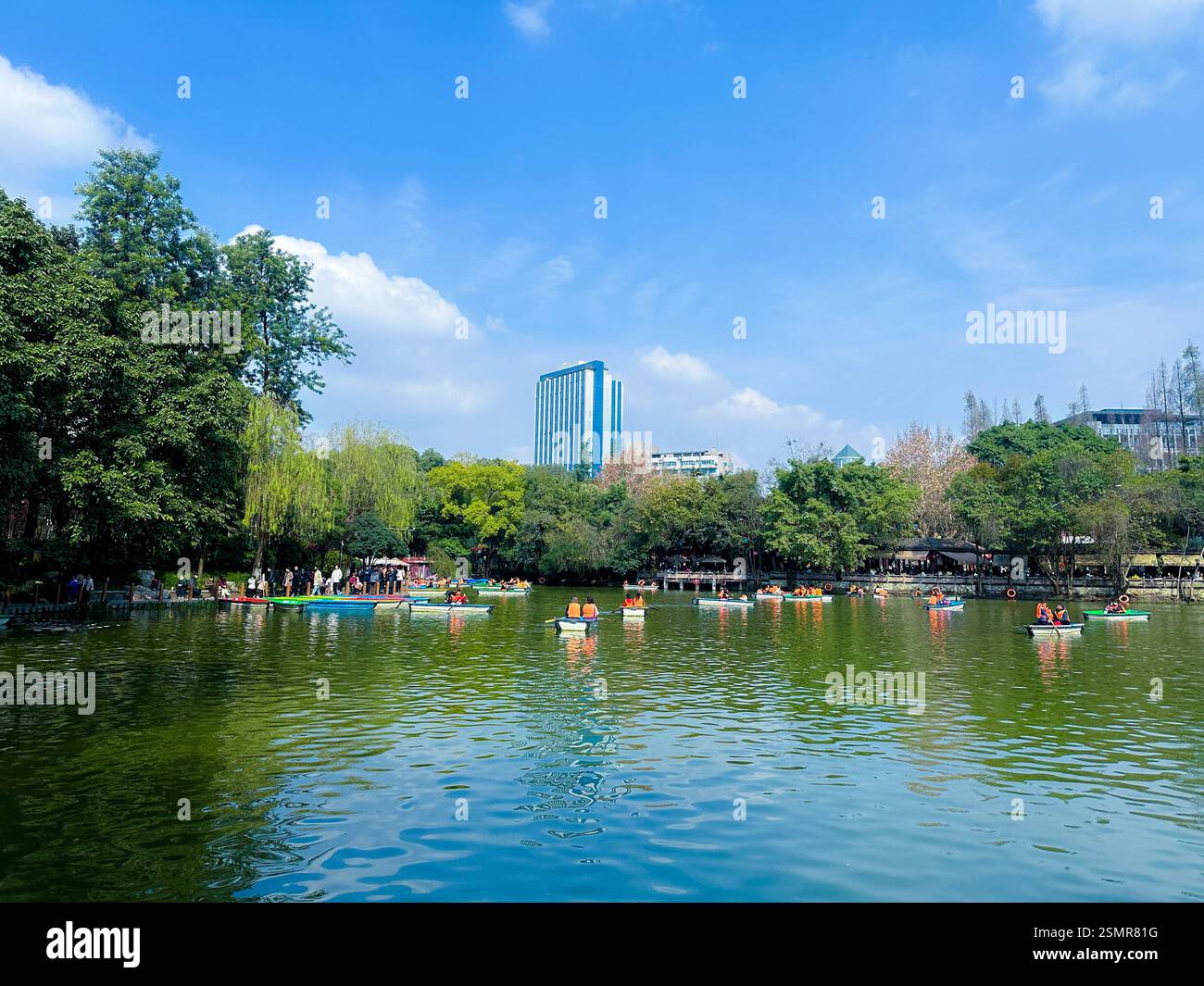 People enjoy early spring time at a park in Chengdu City, southwest ...