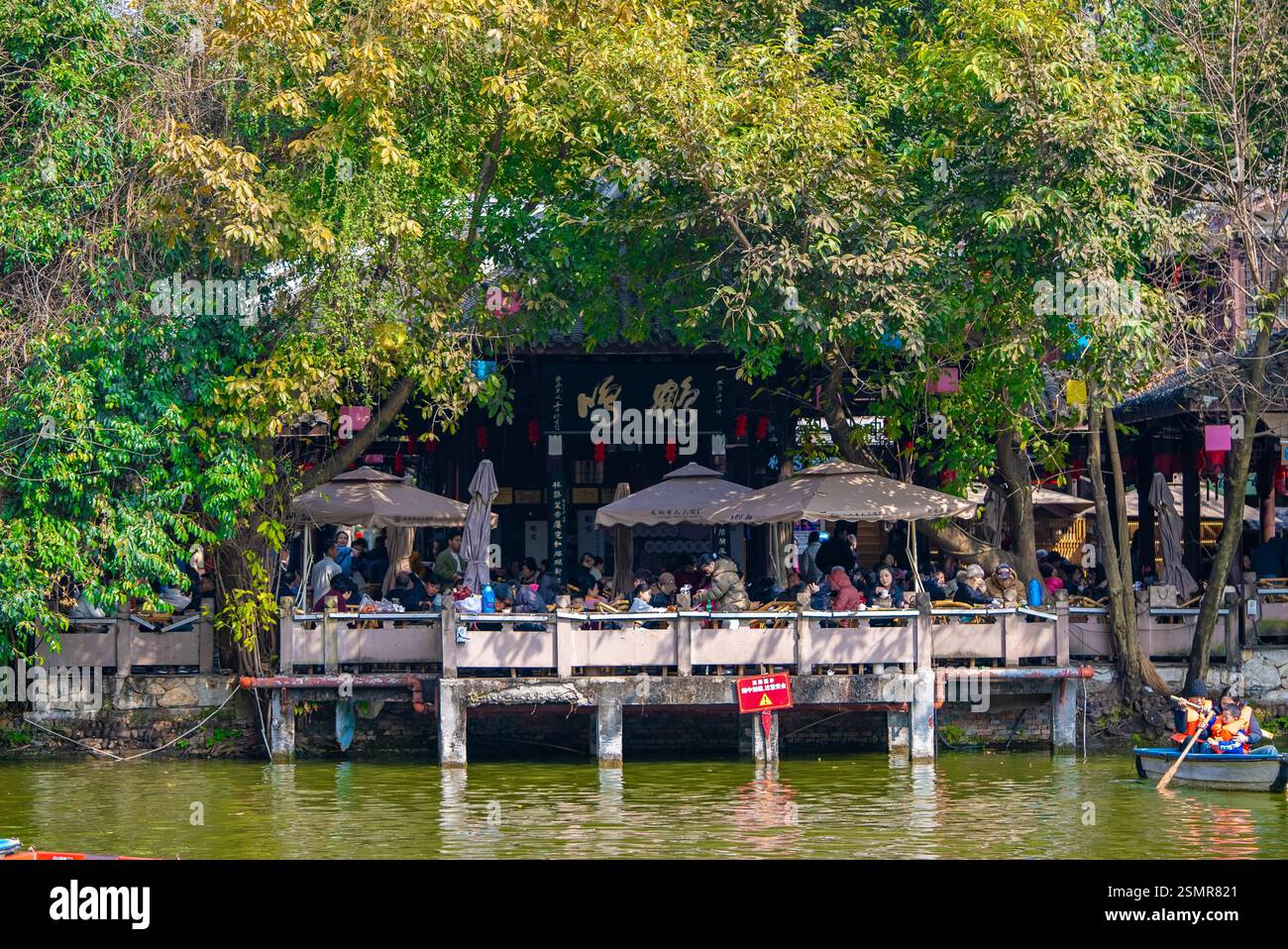 People enjoy early spring time at a park in Chengdu City, southwest ...