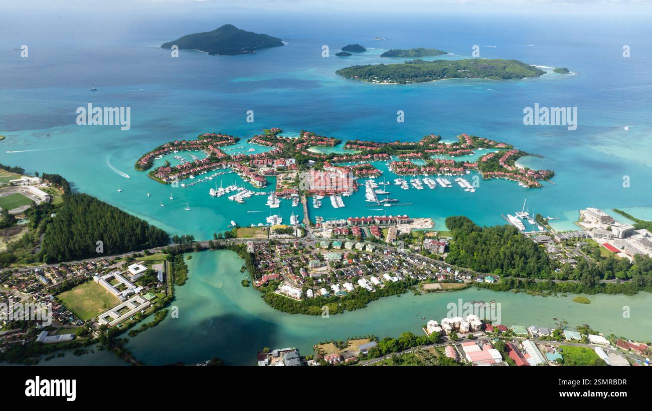Aerial view of Eden Island's marinas filled with boats, clear blue ...