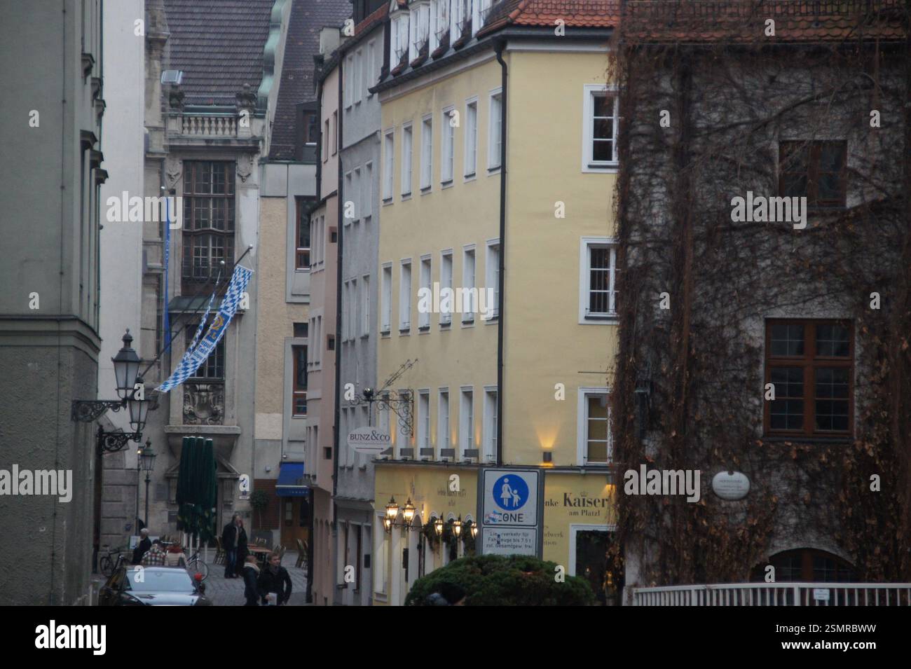 A photo of a hotel with signage in Greek, German, and English. The ...