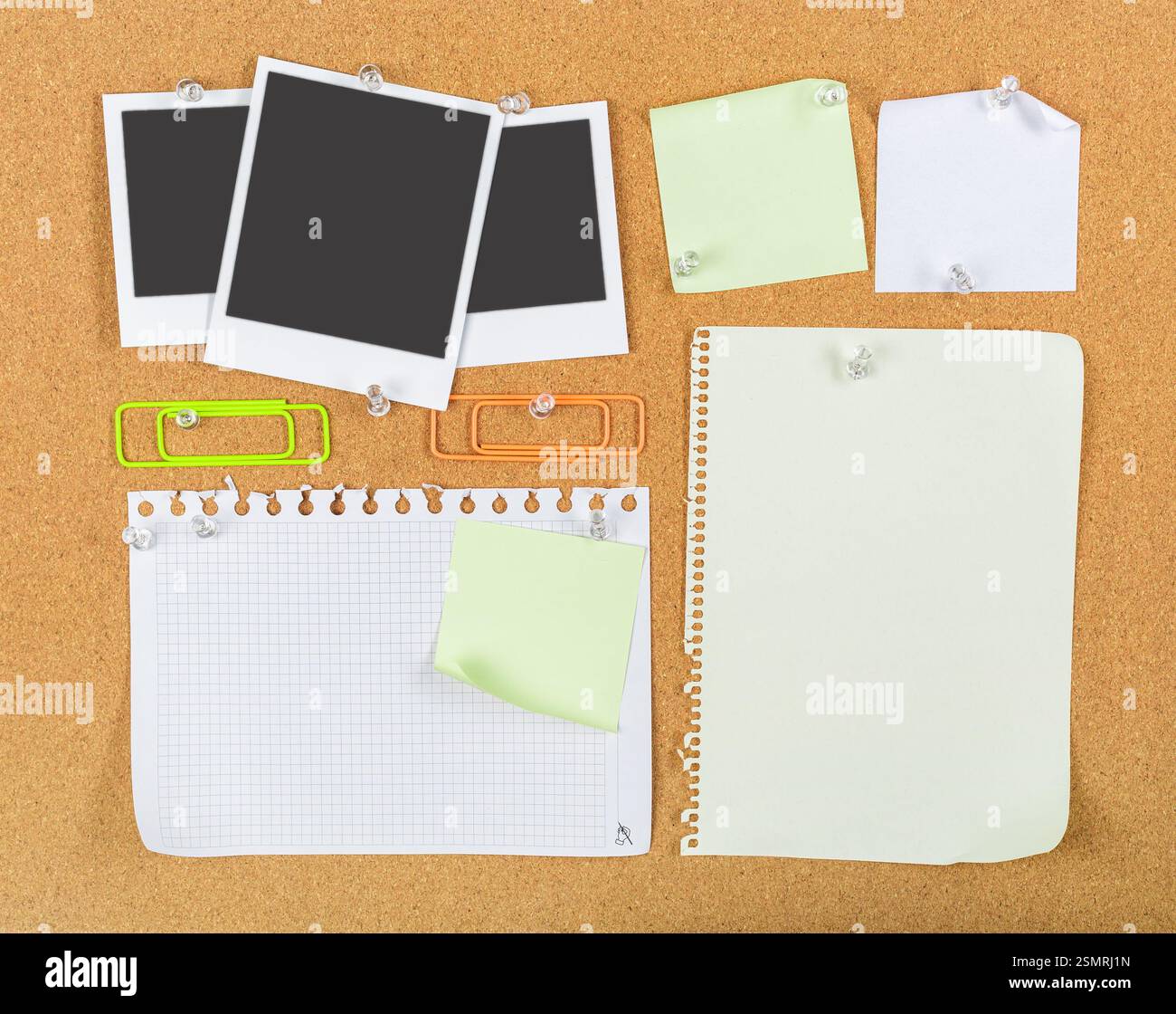 Collection of empty notes and photos pinned on a corkboard at a ...