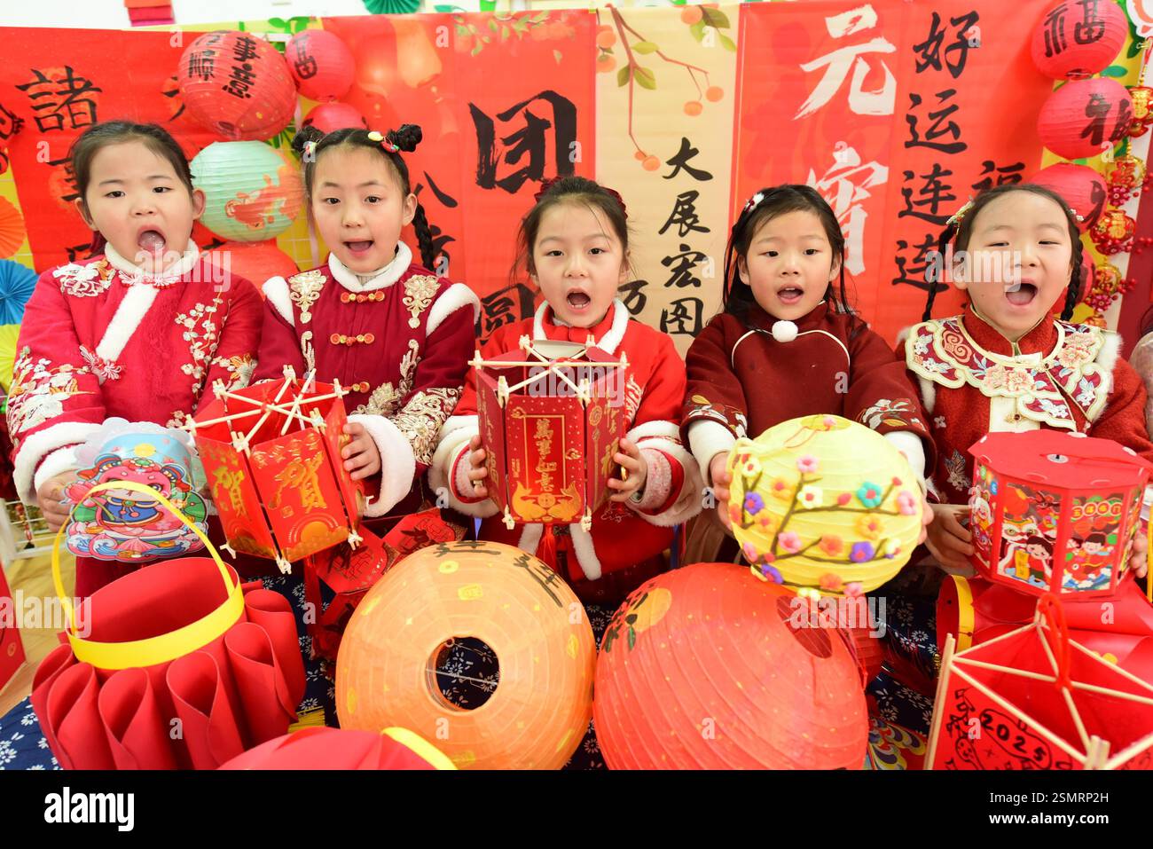 Children learn to make lanterns to welcome the Lantern Festival in ...