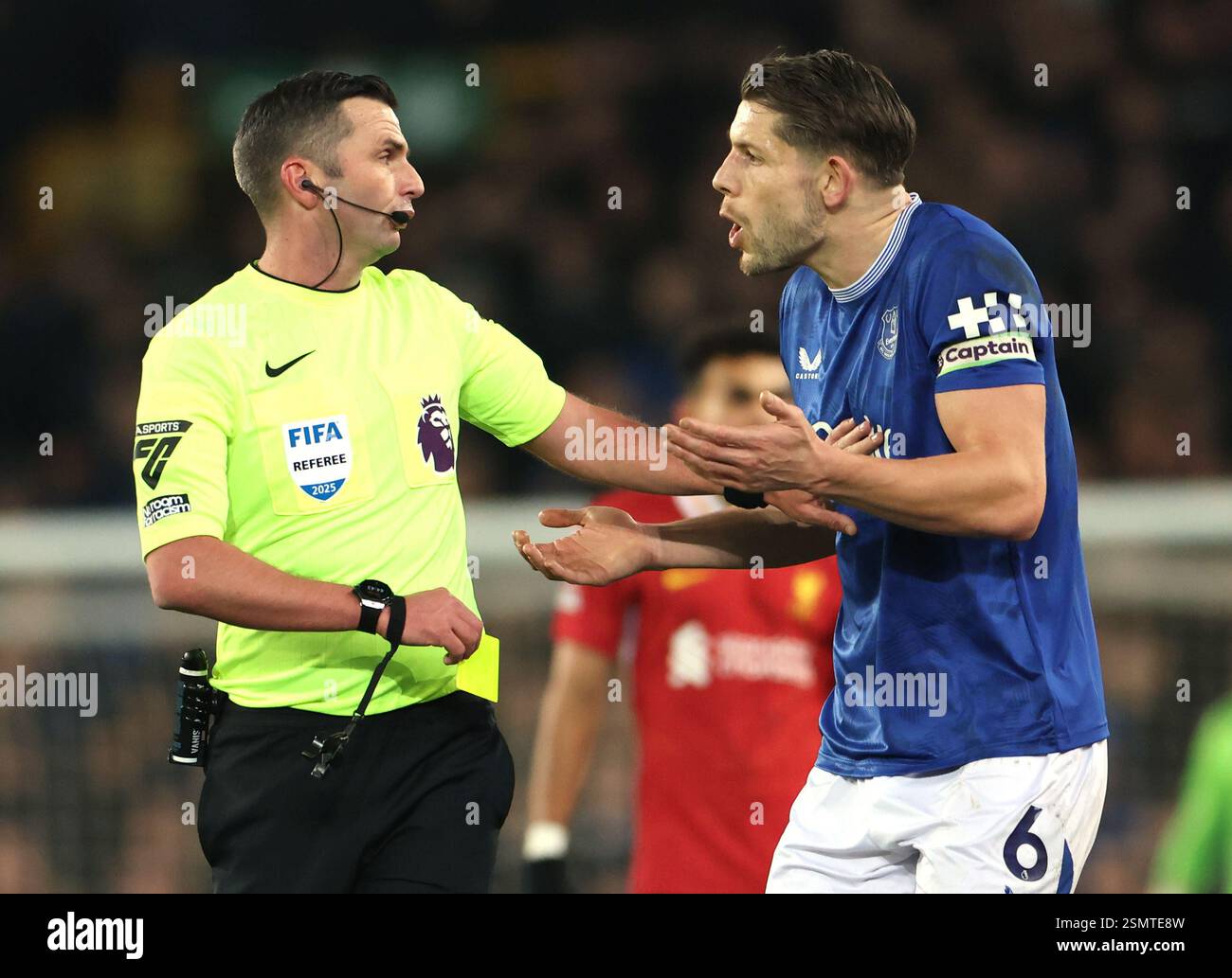 Liverpool, UK. 12th Feb, 2025. James Tarkowski of Everton talks to ...