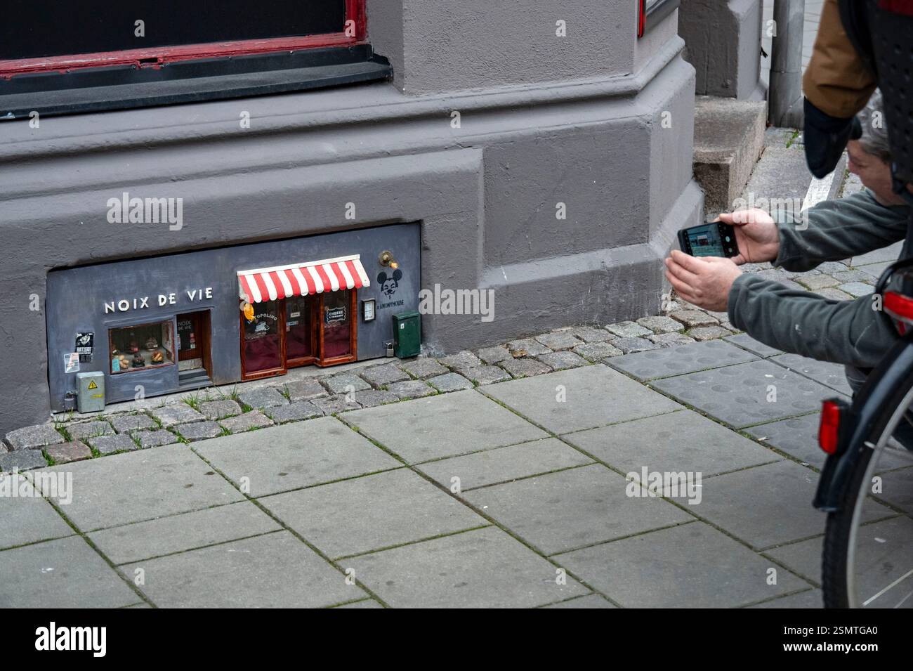 Artists Elin Westerholm and Lupus Nensén in front of the miniature nut ...
