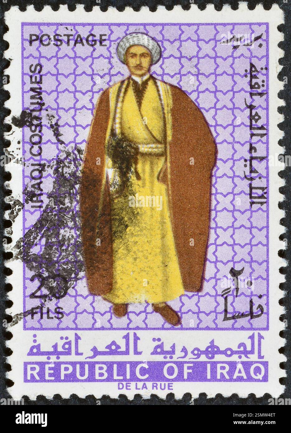 Cancelled postage stamp printed by Iraq, that shows Man in traditional ...