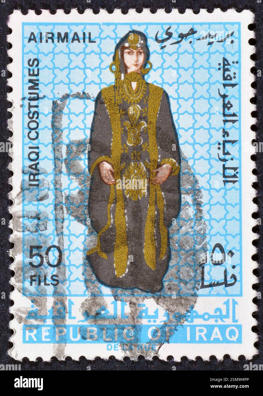 Cancelled postage stamp printed by Iraq, that shows Woman in ...