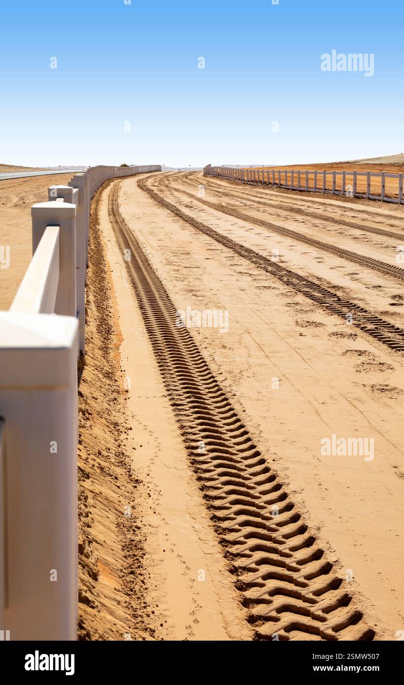 Sandy Camel Racetrack in Desert, Desert road Stock Photo - Alamy