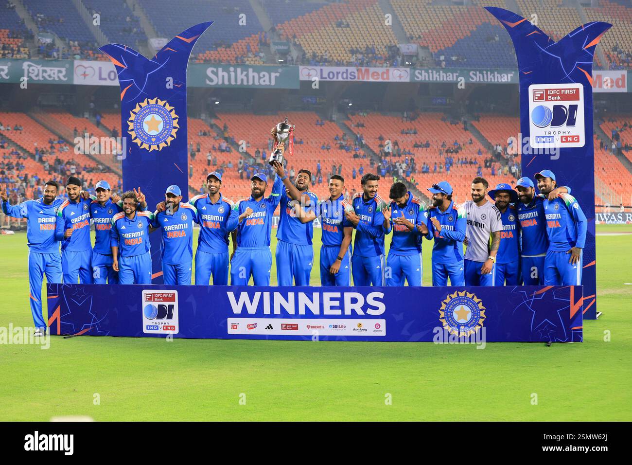 AHMEDABAD, INDIA - FEBRUARY 12: Indian team pose with winner trophy ...