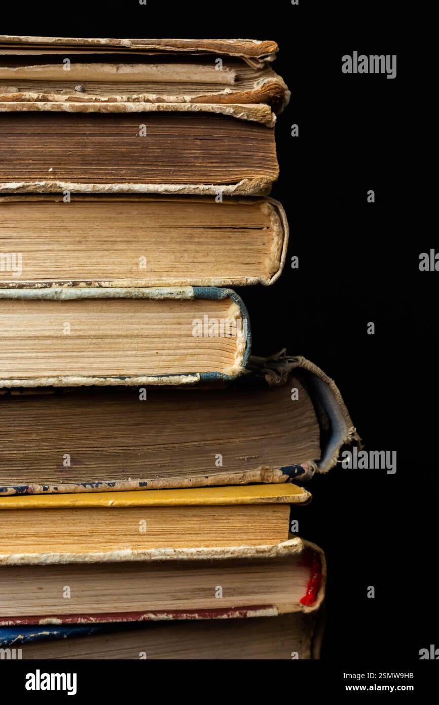 Book background. Stack of books in the library. Old yellow pages of ...