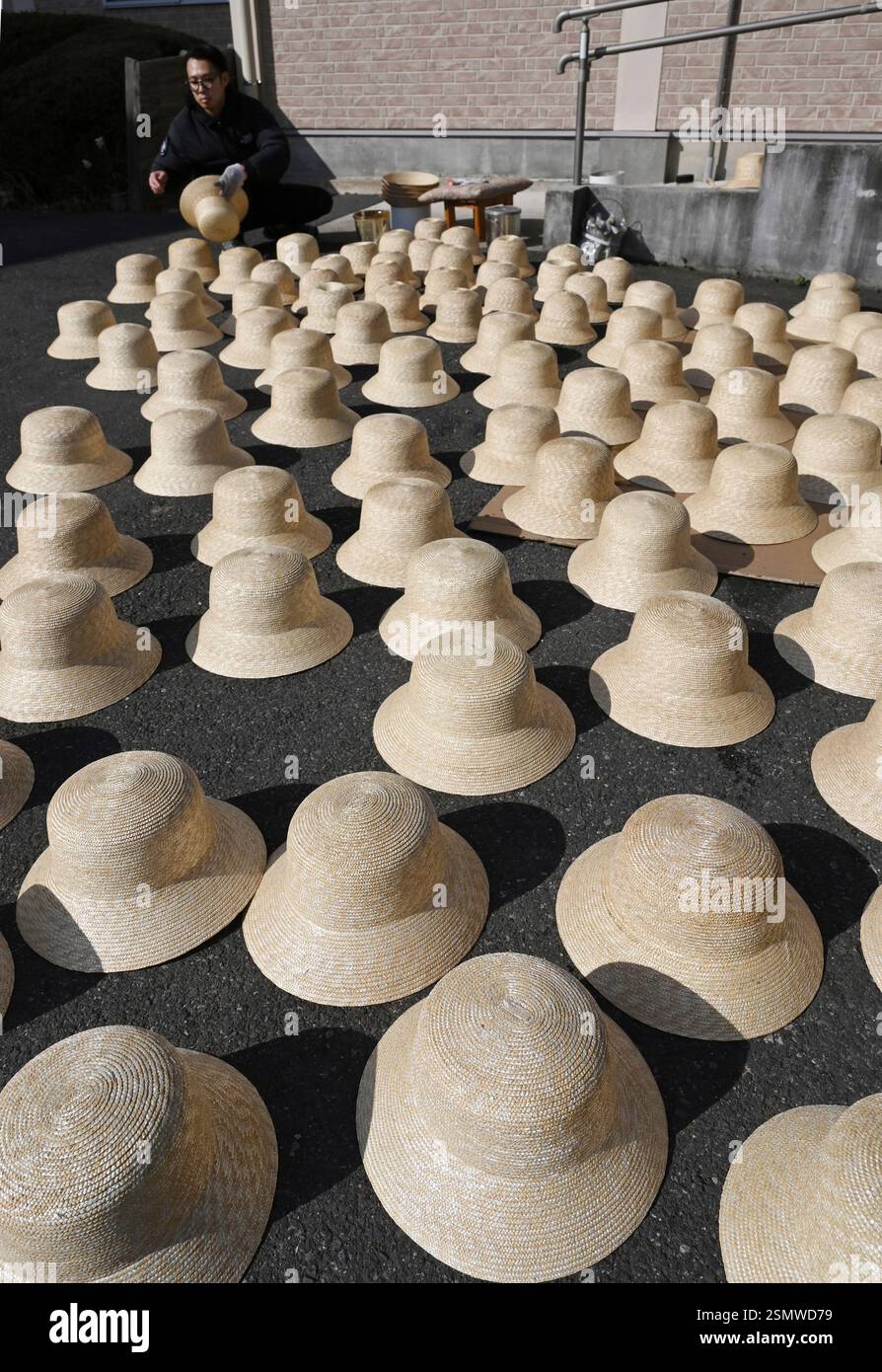 Straw hats are dried in cold air at Tanaka Hat, a company that makes ...