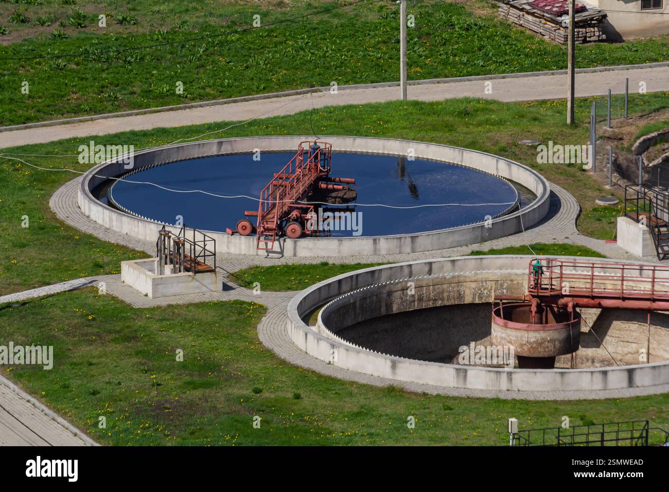 Circular water treatment tanks are visible in this facility, showing ...