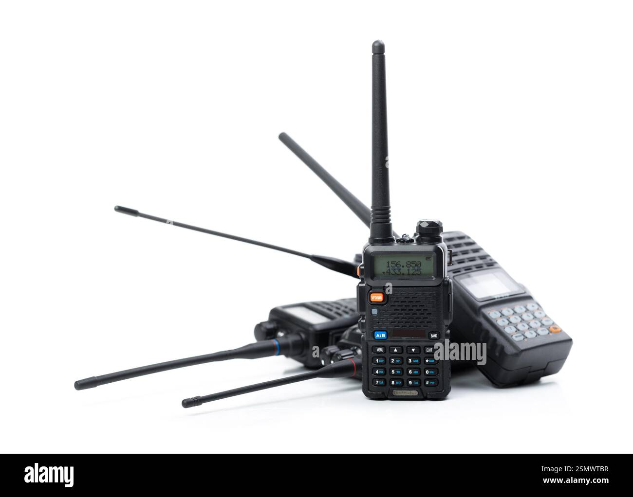 Multiple portable radios stacked together with extended antennas in a ...