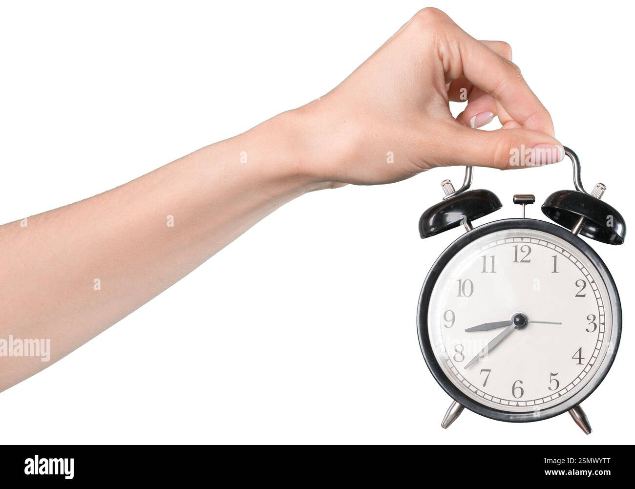 Holding a classic alarm clock during morning routine to ensure ...