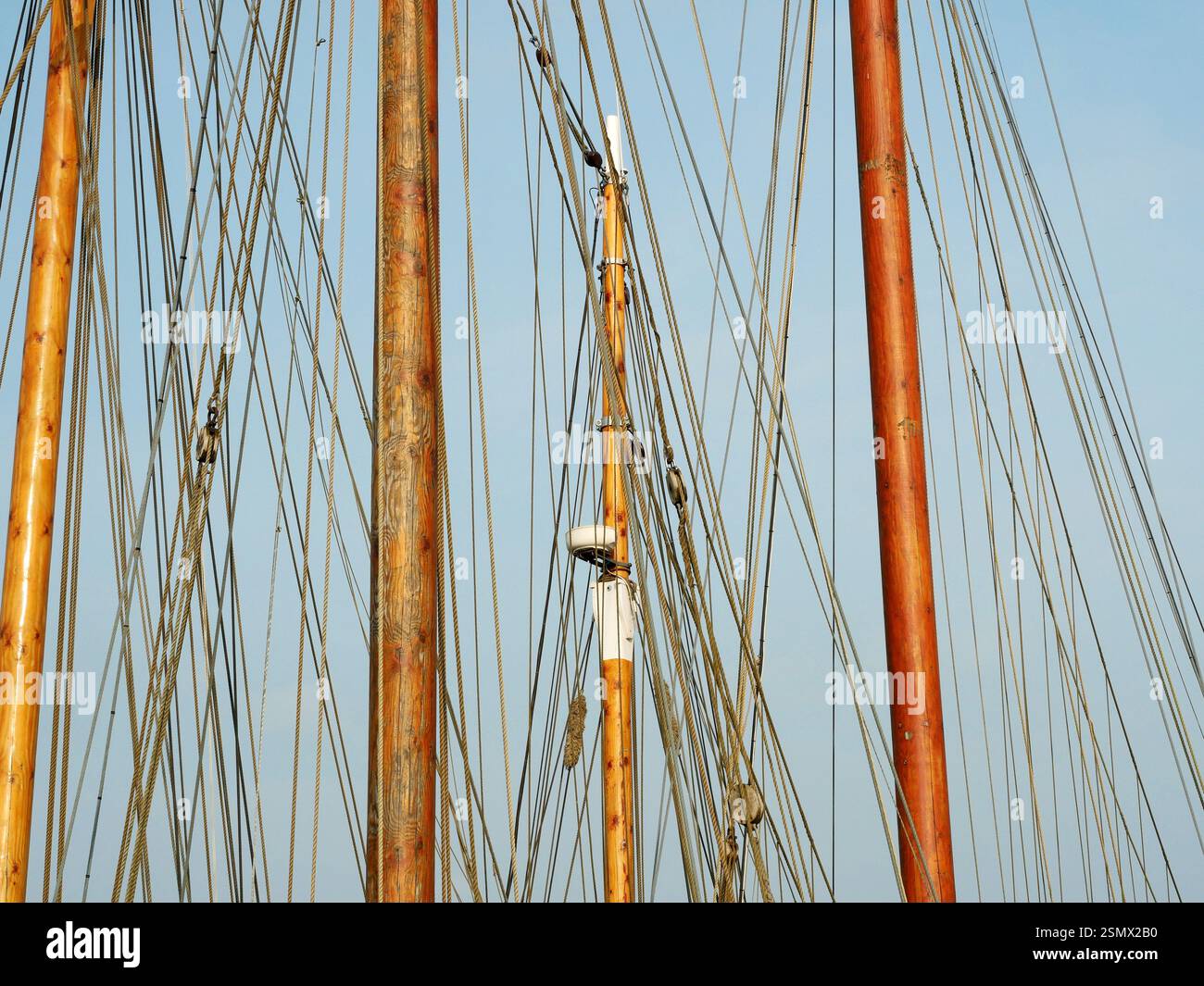 The rigging with countless ropes on a sailing ship’s mast looks ...