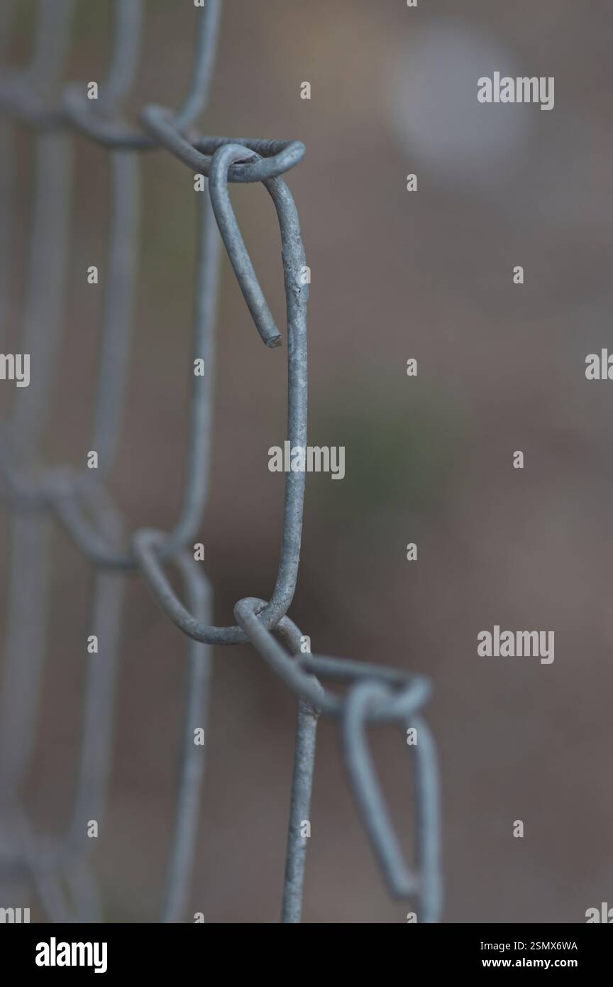 Close up of edge of chain link fence wire Stock Photo - Alamy