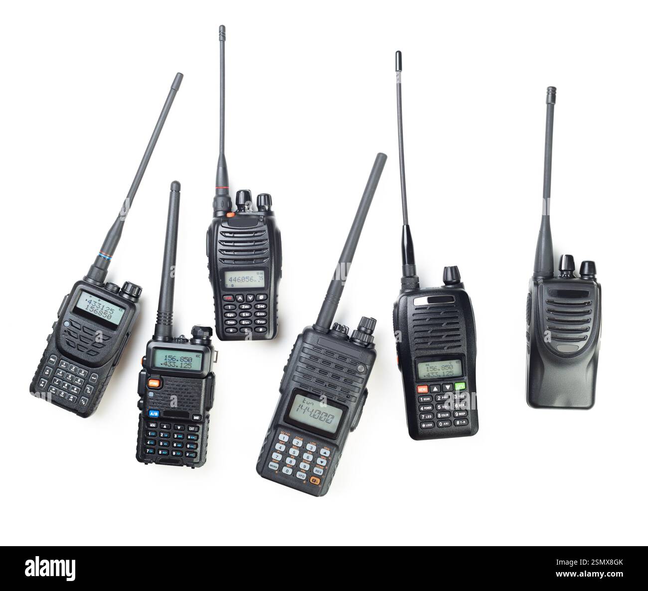 Collection of various walkie-talkies arranged on a white background ...