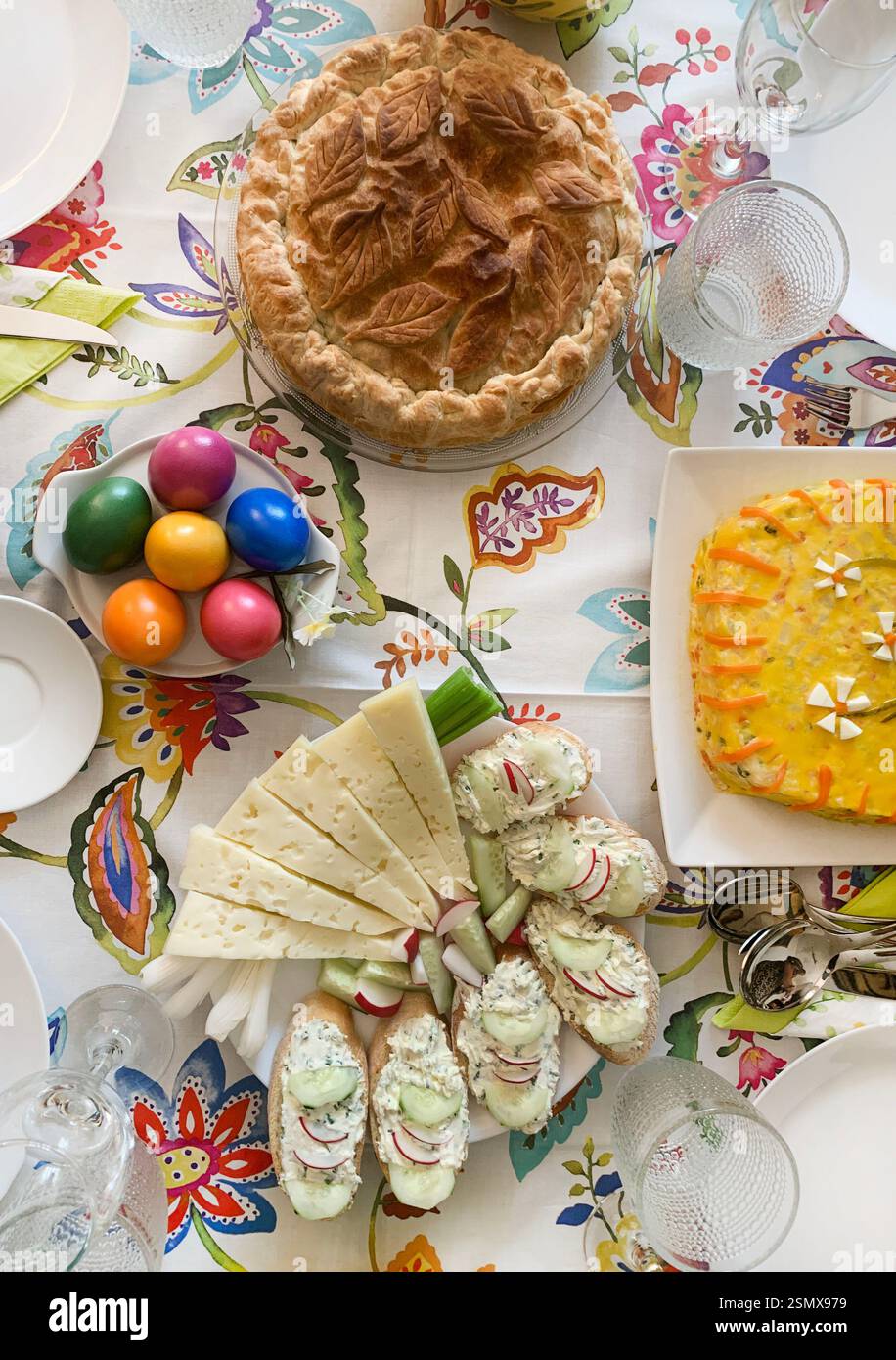 Traditional Easter food. Easter savory pie, Olivier salad, Easter eggs ...