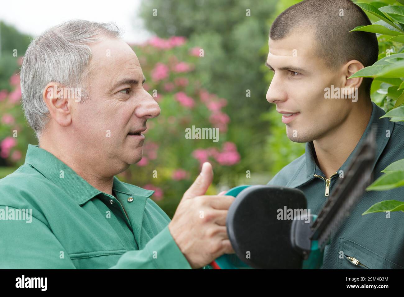 Smiling men gardeners standing hi-res stock photography and images - Alamy