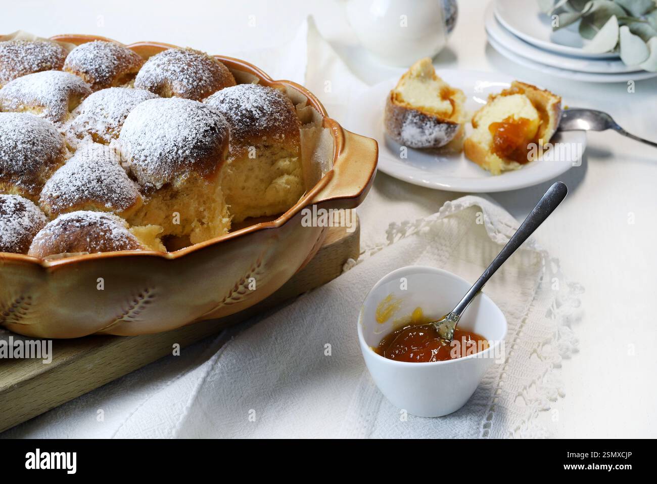 Homemade Austrian Buchteln filled with apricot jam isolated on white ...