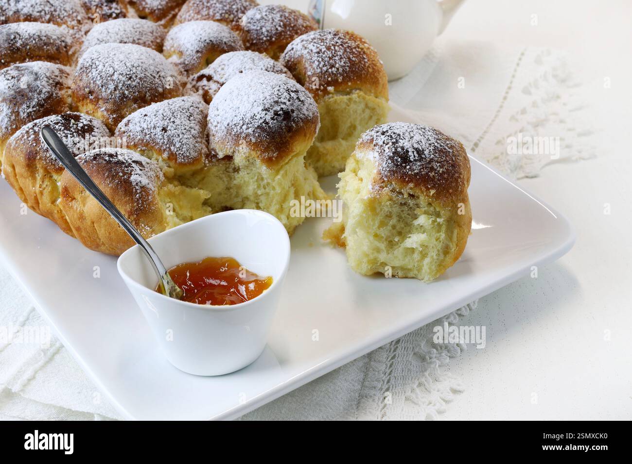 Homemade Austrian Buchteln filled with apricot jam isolated on white ...