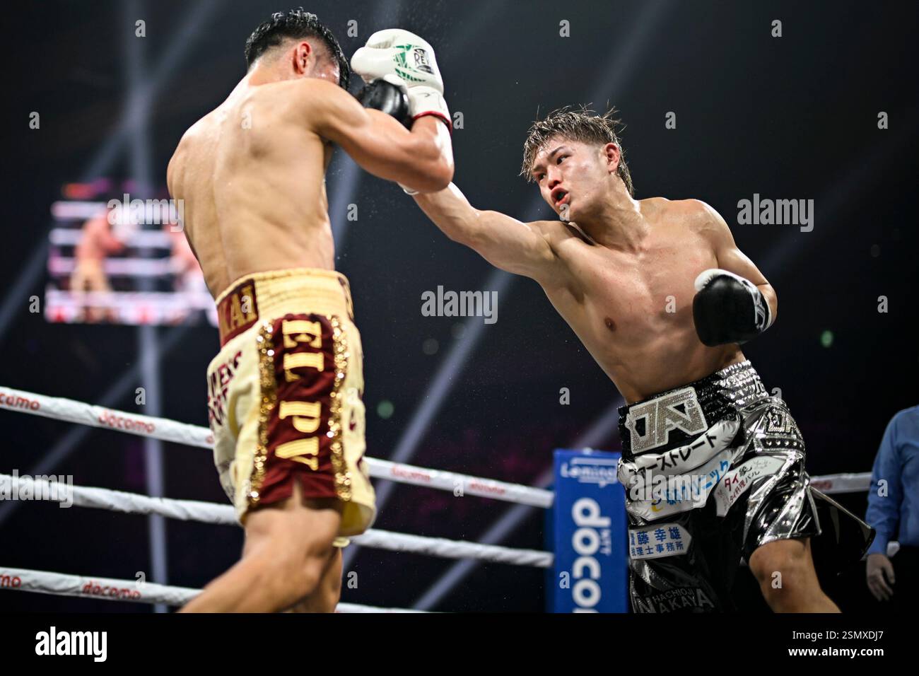 Tokyo, Japan. 24th Jan, 2025. Champion Jin Sasaki (black gloves) throws a right at challenger ...