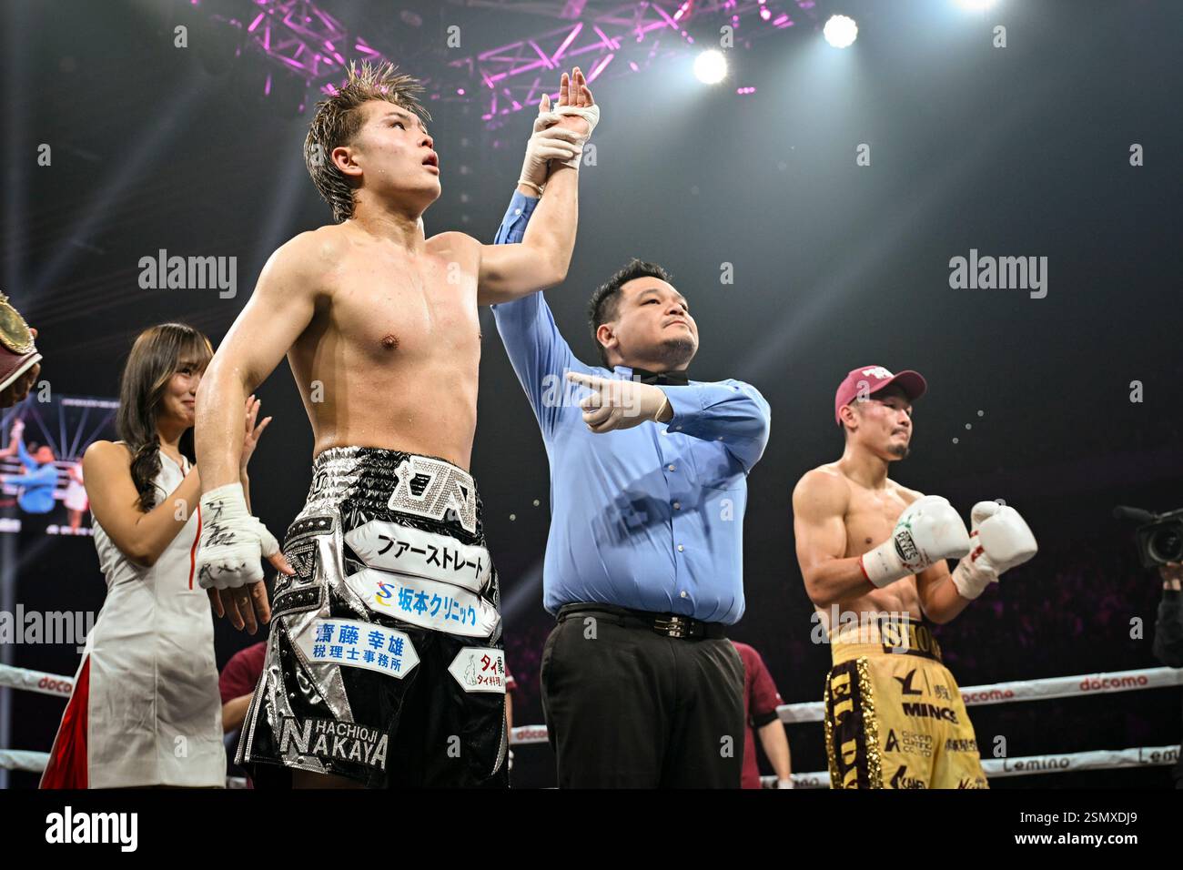 Tokyo, Japan. 24th Jan, 2025. Champion Jin Sasaki, left, reacts to his unanimous decision ...
