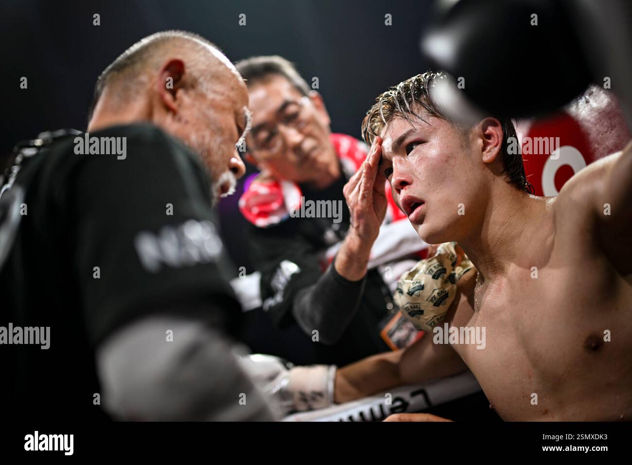 Tokyo, Japan. 24th Jan, 2025. Champion Jin Sasaki, right, listens to Hirotaka Nakaya, left, as ...