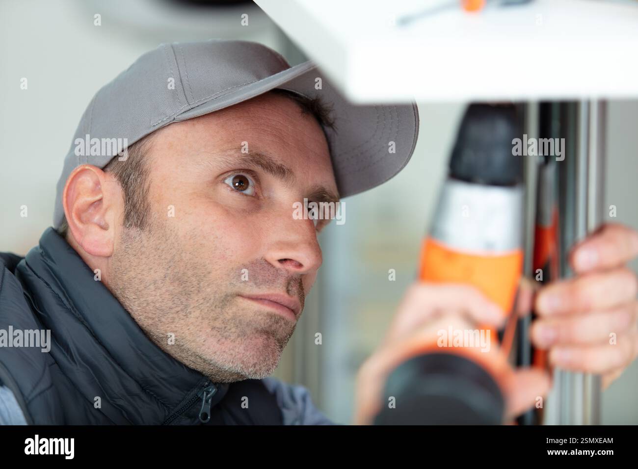 Serious builder using drill hi-res stock photography and images - Alamy
