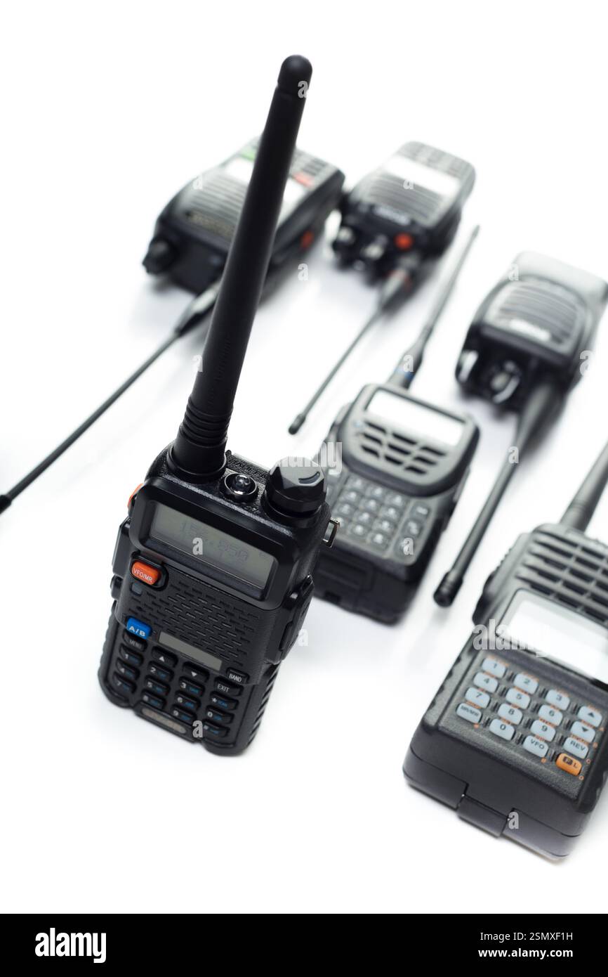 Various handheld radios arranged on a white background showcasing ...