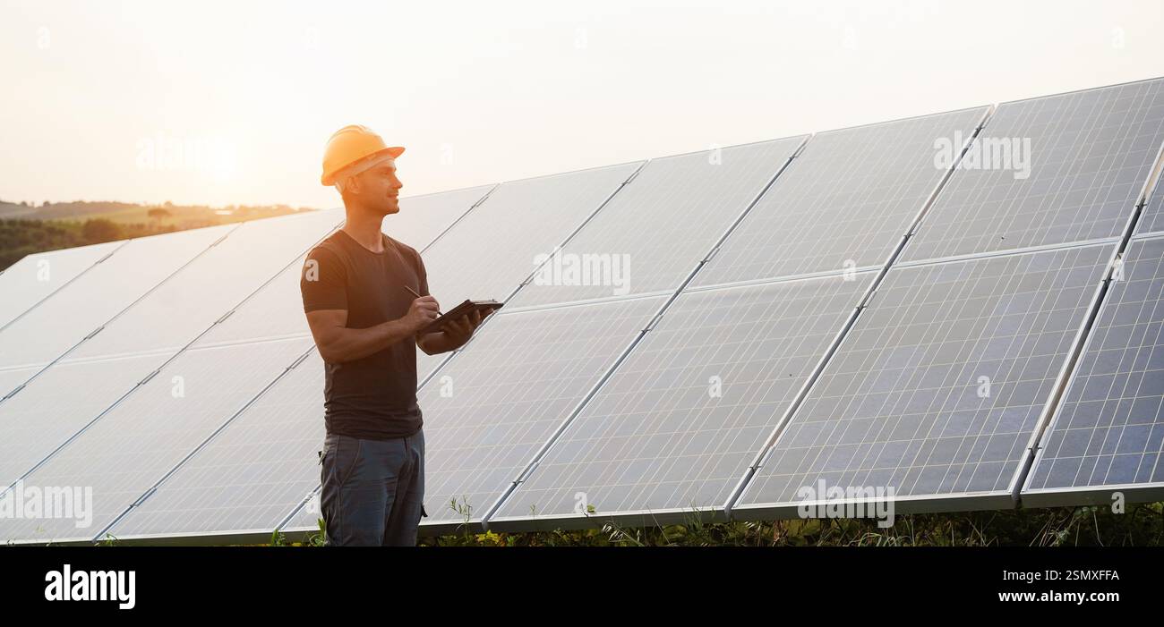 Engineer working at solar panels factory outdoor - Photovoltaic ...
