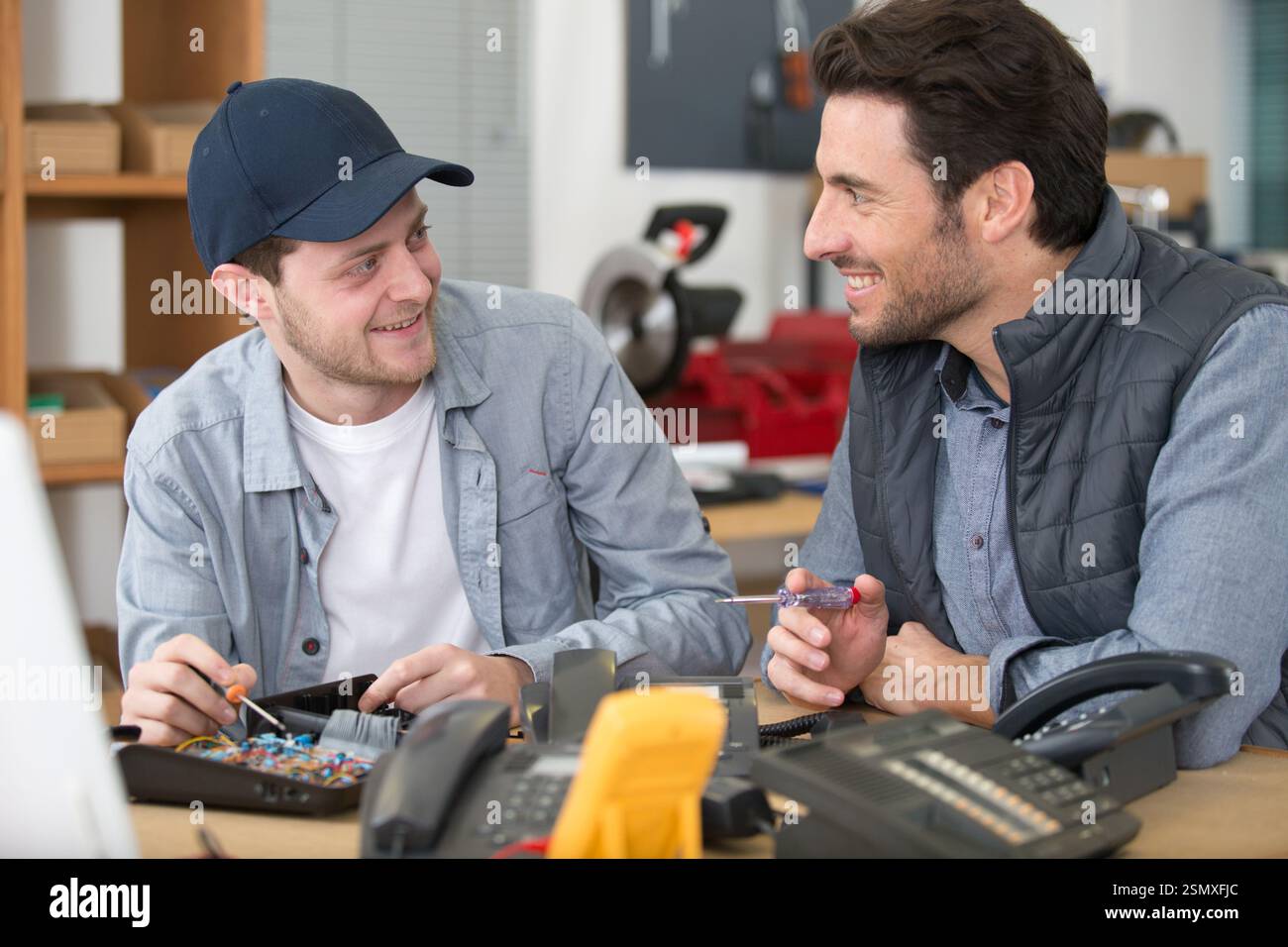 teacher with apprentice learning the trade Stock Photo - Alamy