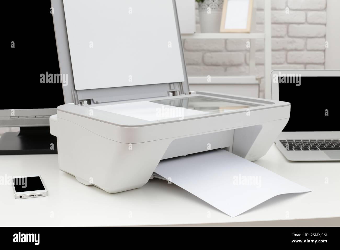 Home office setup with a printer scanning documents during a busy ...