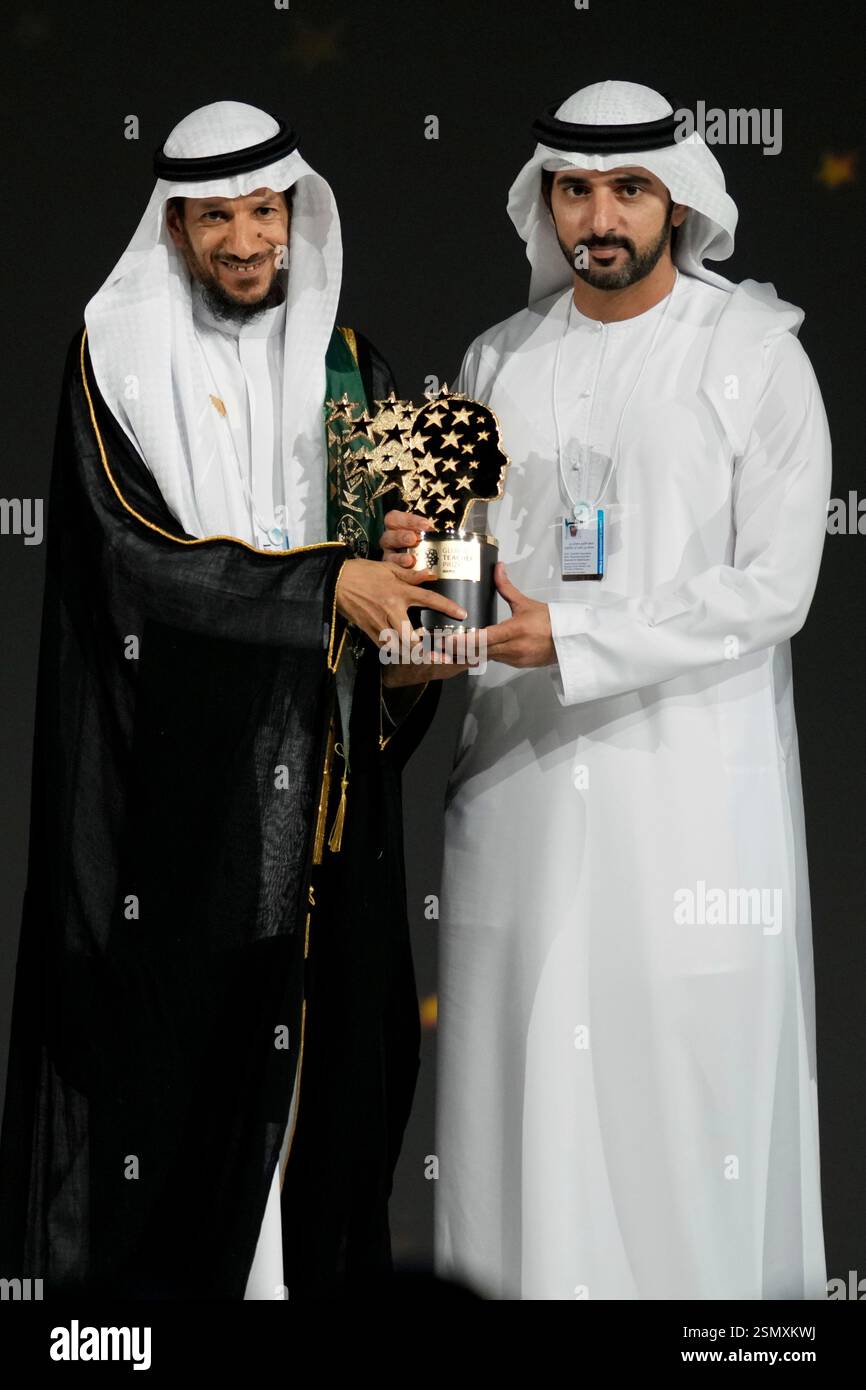 Saudi Arabian teacher Mansour bin Abdullah Al-Mansour, left, receives the Global Teacher Prize ...