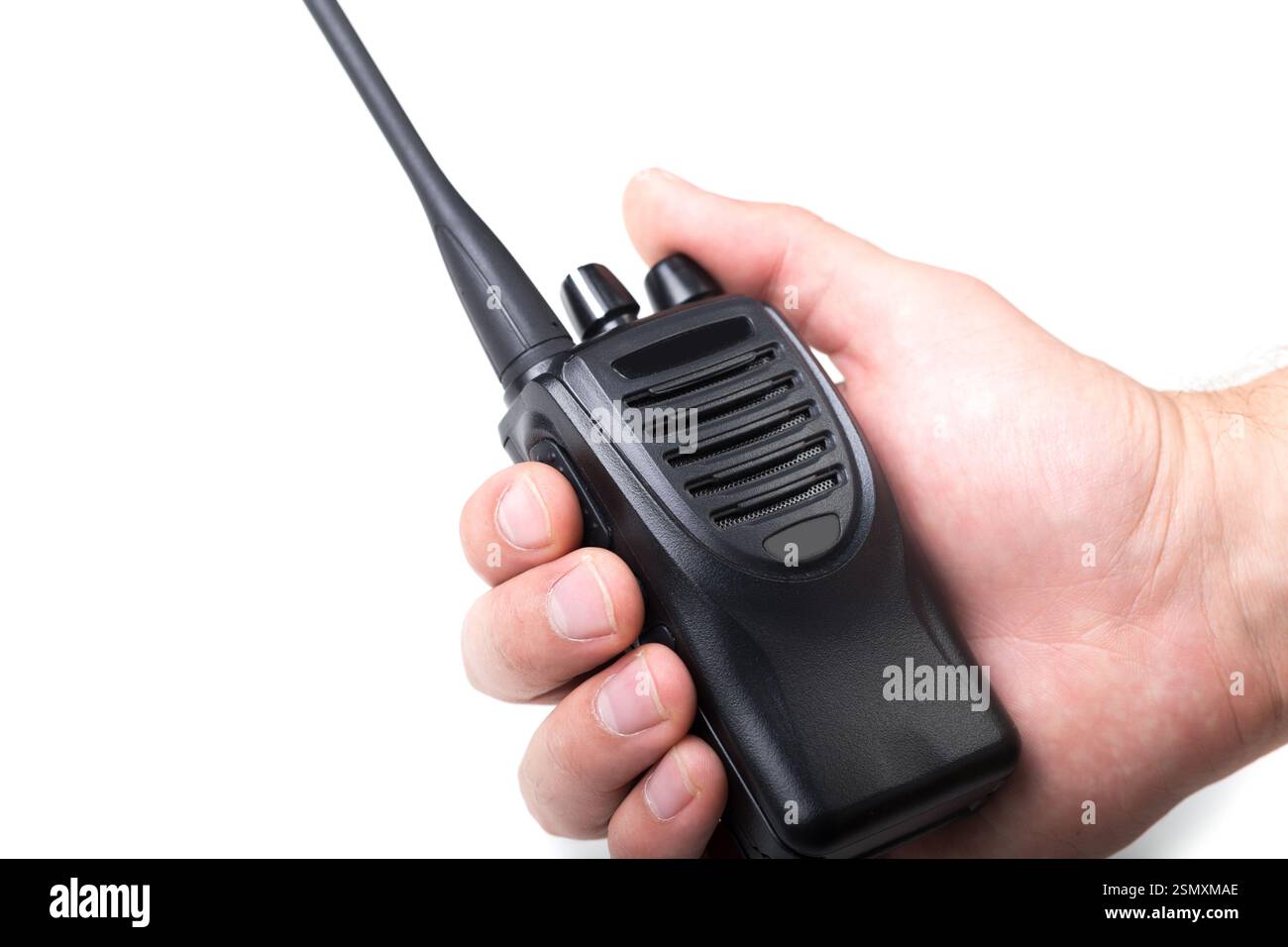 Handheld radio in use during communication at an outdoor event in ...
