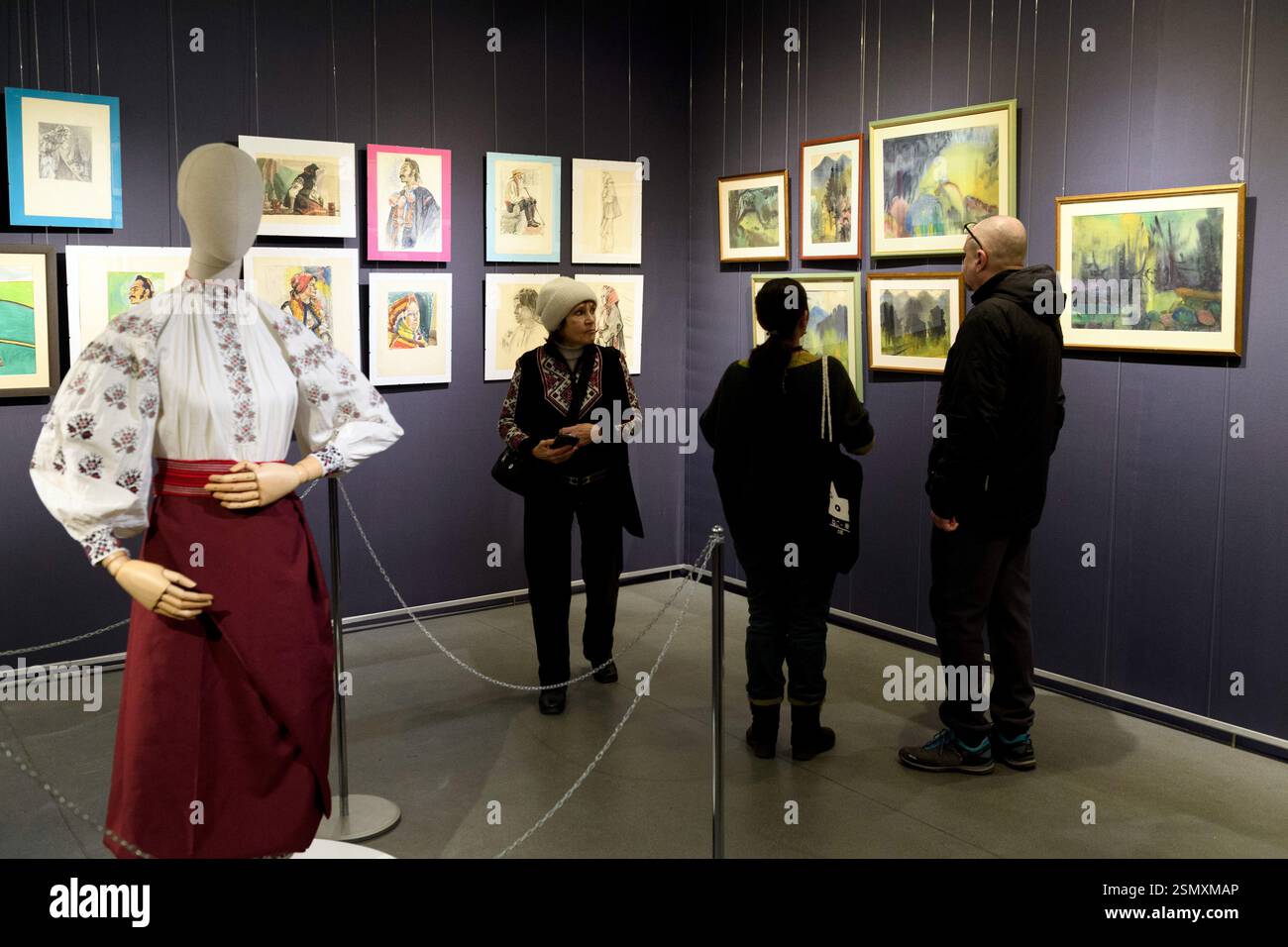KYIV, UKRAINE - FEBRUARY 12, 2025 - People look at showpieces during ...