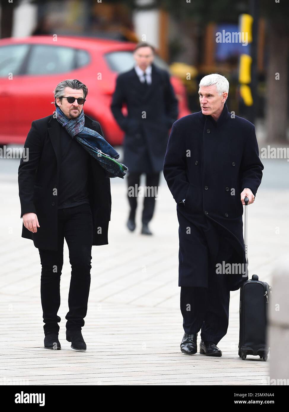 Joey Barton (left) arrives at Liverpool Crown Court, where he is charged with sending offensive ...