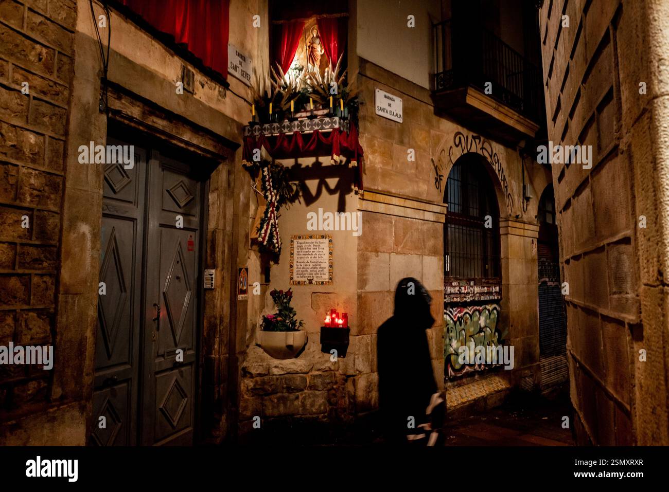 In an alley of the Gothic Quarter, the statue of Santa Eulalia, patron ...