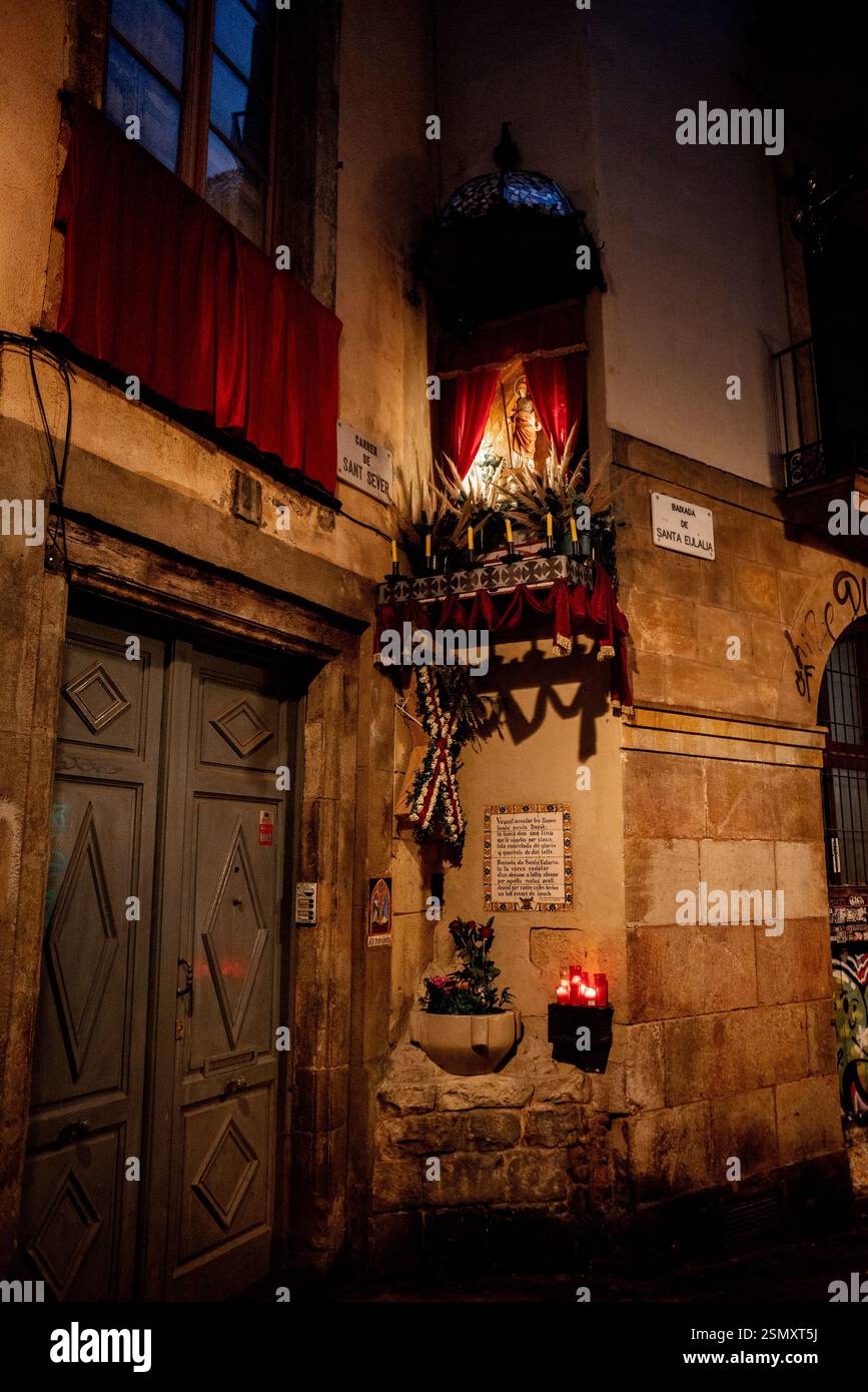 In an alley of the Gothic Quarter, the statue of Santa Eulalia, patron ...