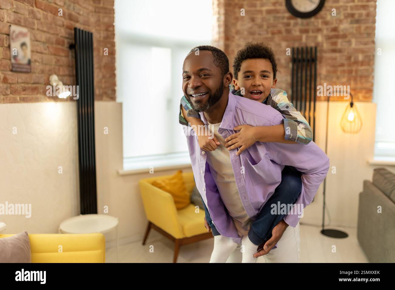 Dad and son hugging and looking happy and enjoyed Stock Photo - Alamy