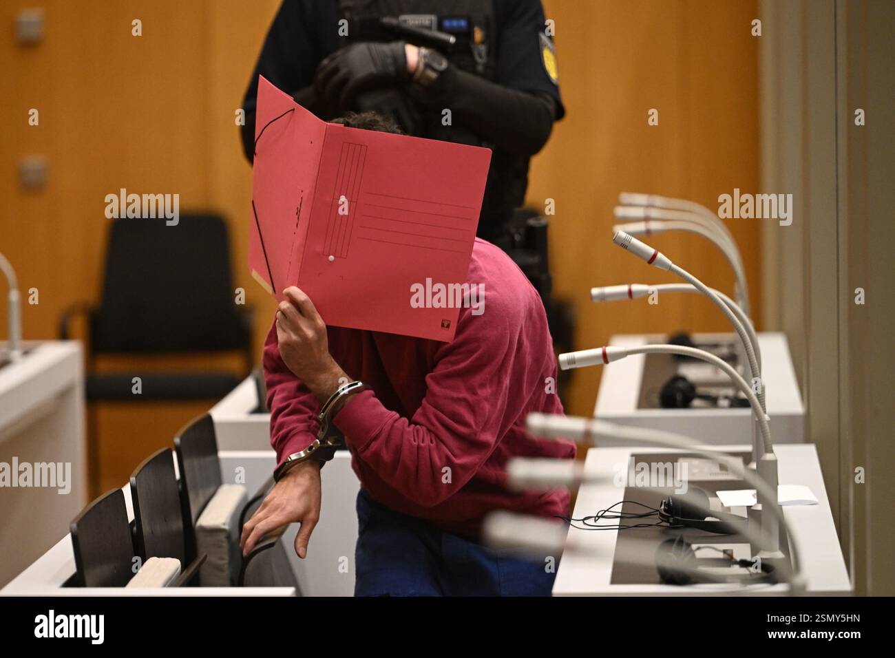 Stuttgart, Germany. 13th Feb, 2025. The defendant Sulaiman A. takes his ...