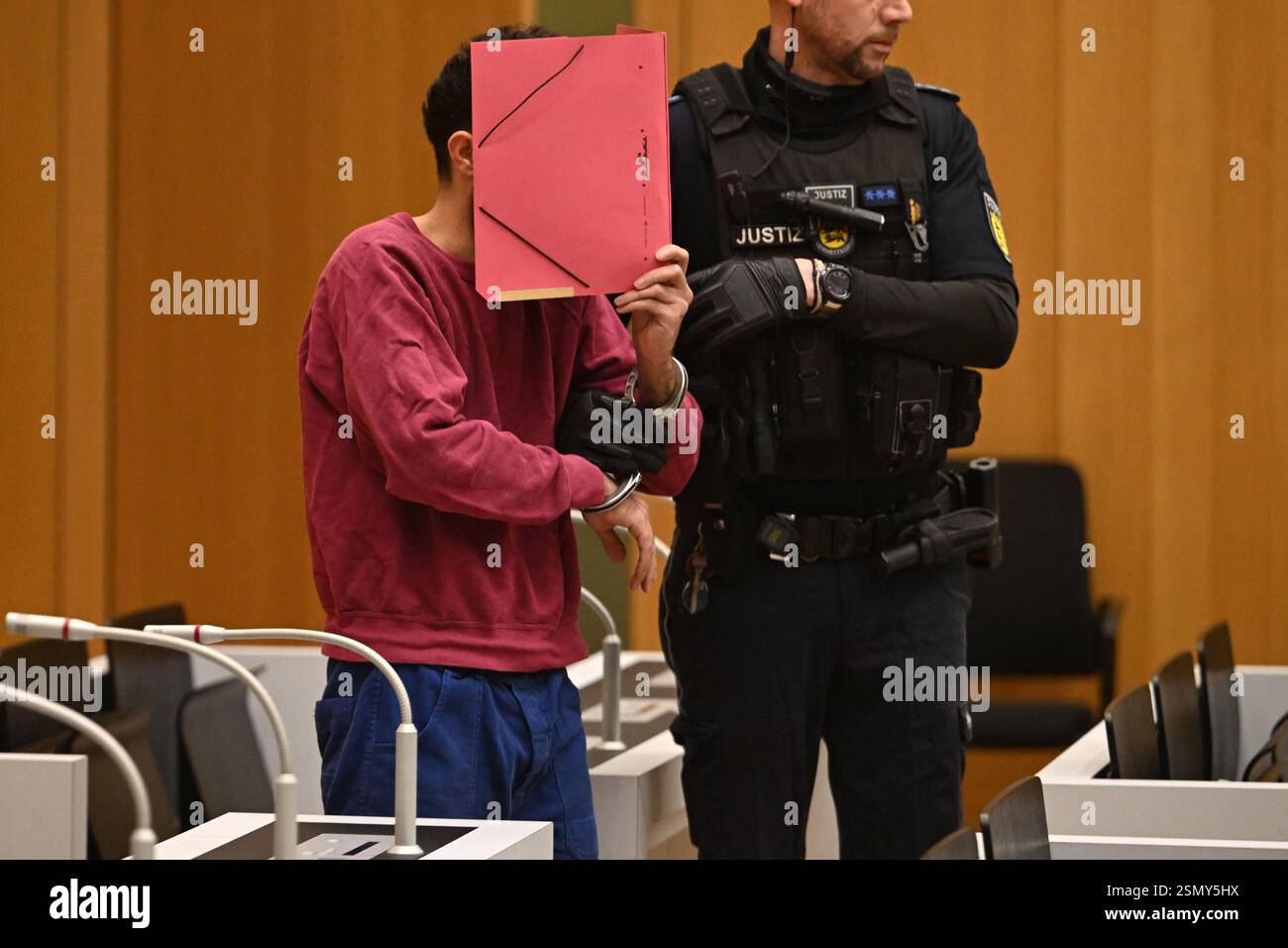 Stuttgart, Germany. 13th Feb, 2025. The accused Sulaiman A. is led to ...