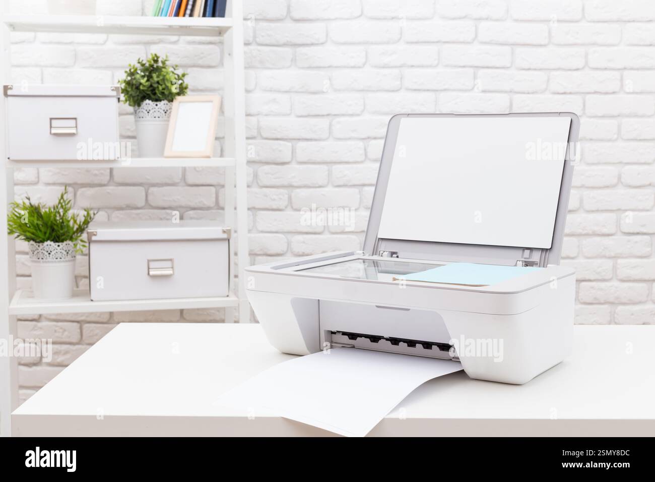 Printer in a minimalist office setting with paper output on a clean ...