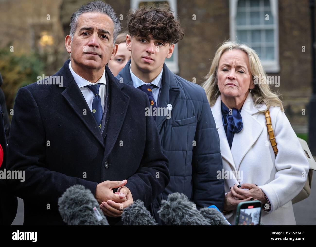 London, UK. 12th Feb 2025. Dr Sanjoy Kumar speaks to press (middle ...