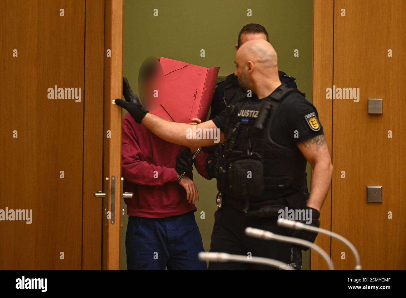 Stuttgart, Germany. 13th Feb, 2025. The defendant Sulaiman A. is led ...