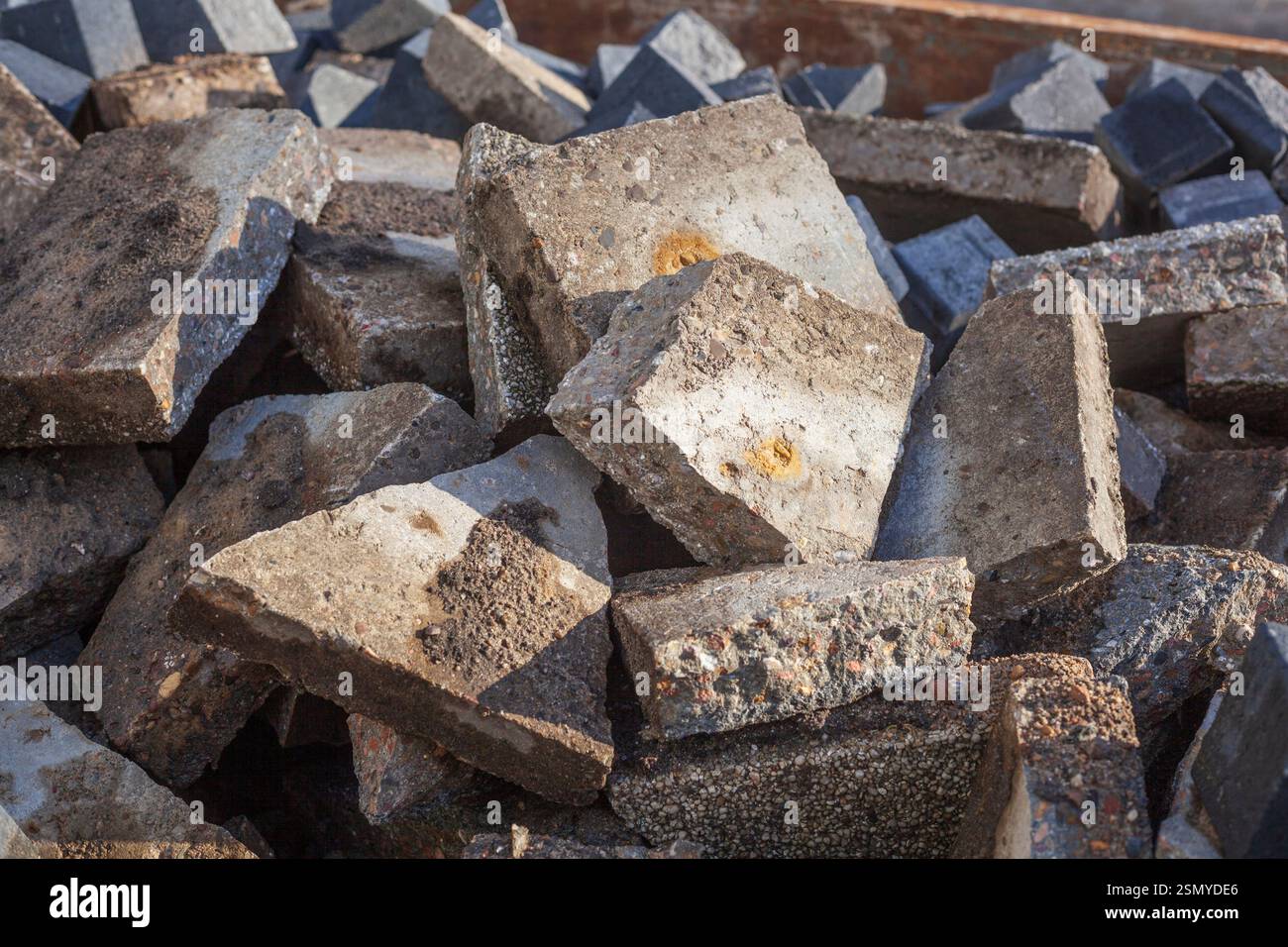 Building rubble, building blocks on a pile of rubble in a dumpster ...