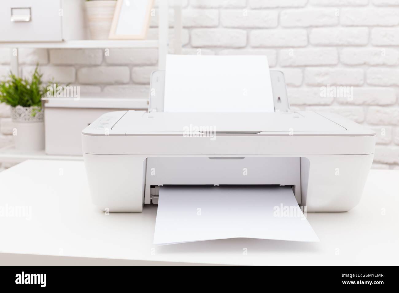 Modern printer in a well-lit office space producing documents with a ...