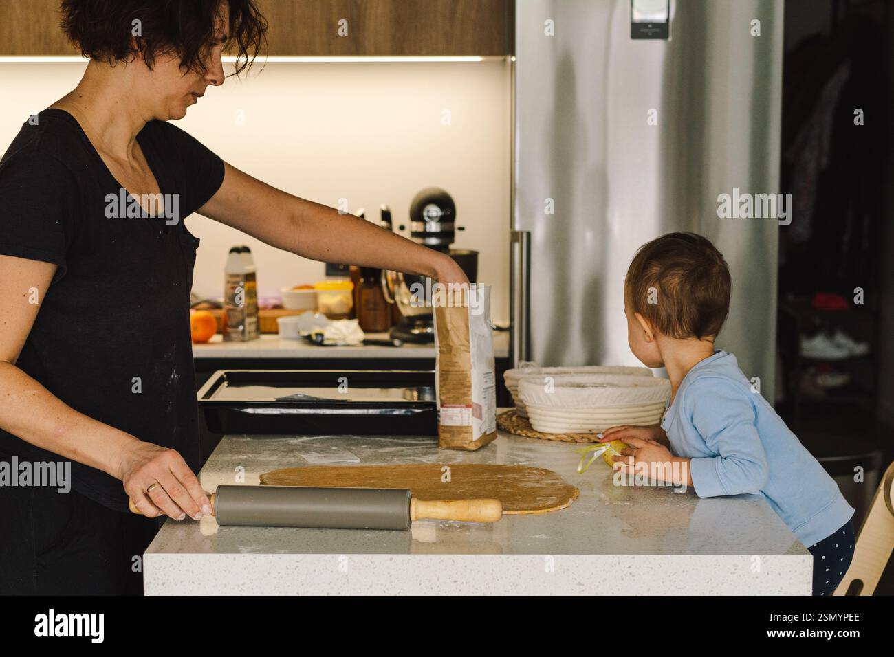 Mother and child are baking. Homemade food and little helper Stock ...