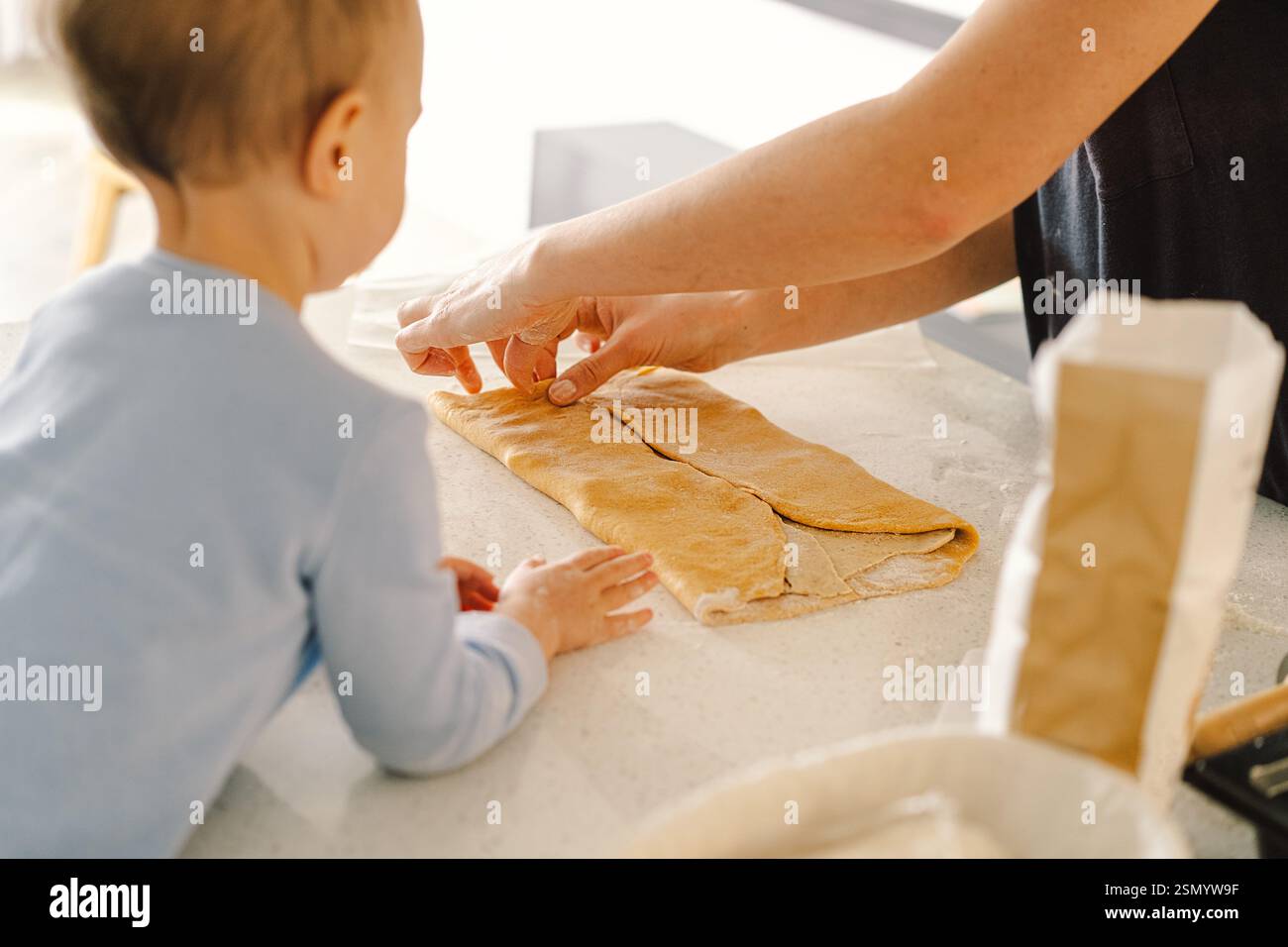 Mother and child are baking. Homemade food and little helper Stock ...