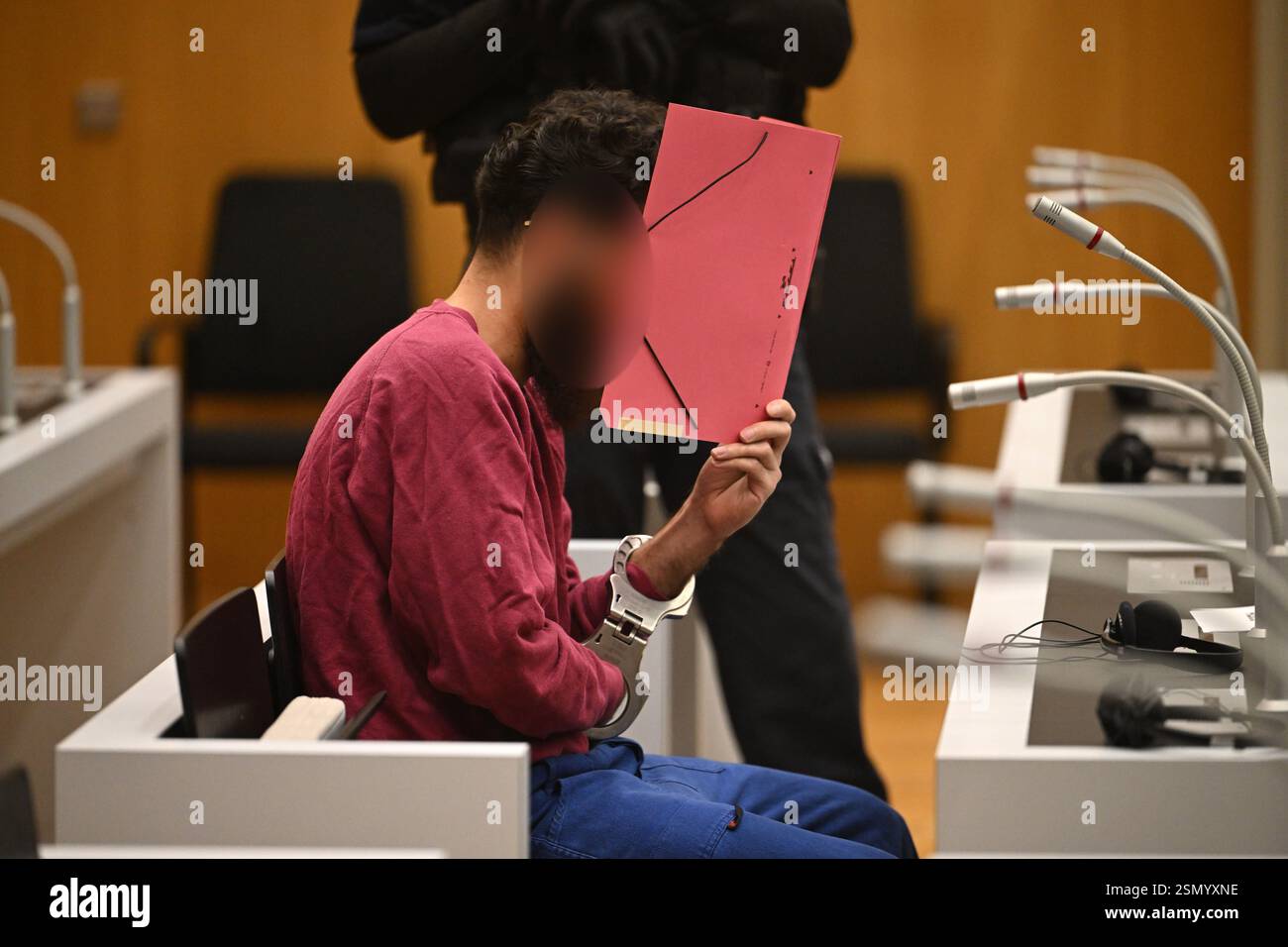 Stuttgart, Germany. 13th Feb, 2025. The defendant Sulaiman A. sits in ...